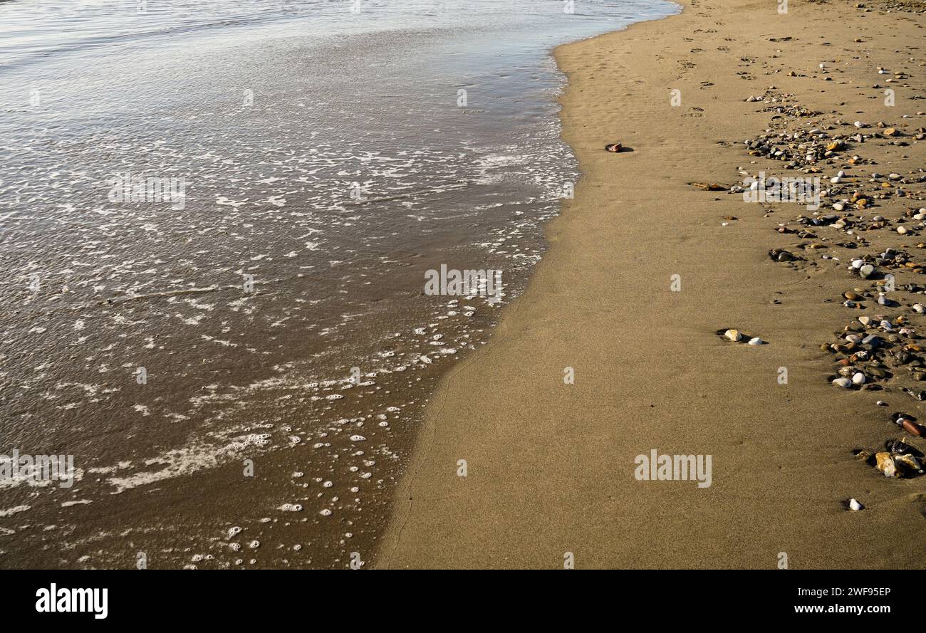 Sea tide sweeping in at beach. Spain Stock Photo - Alamy