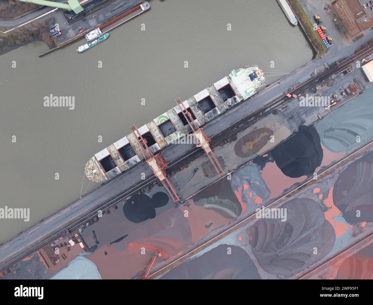 Loading and unloading of raw materials in the port of Hamburg. Top down ...