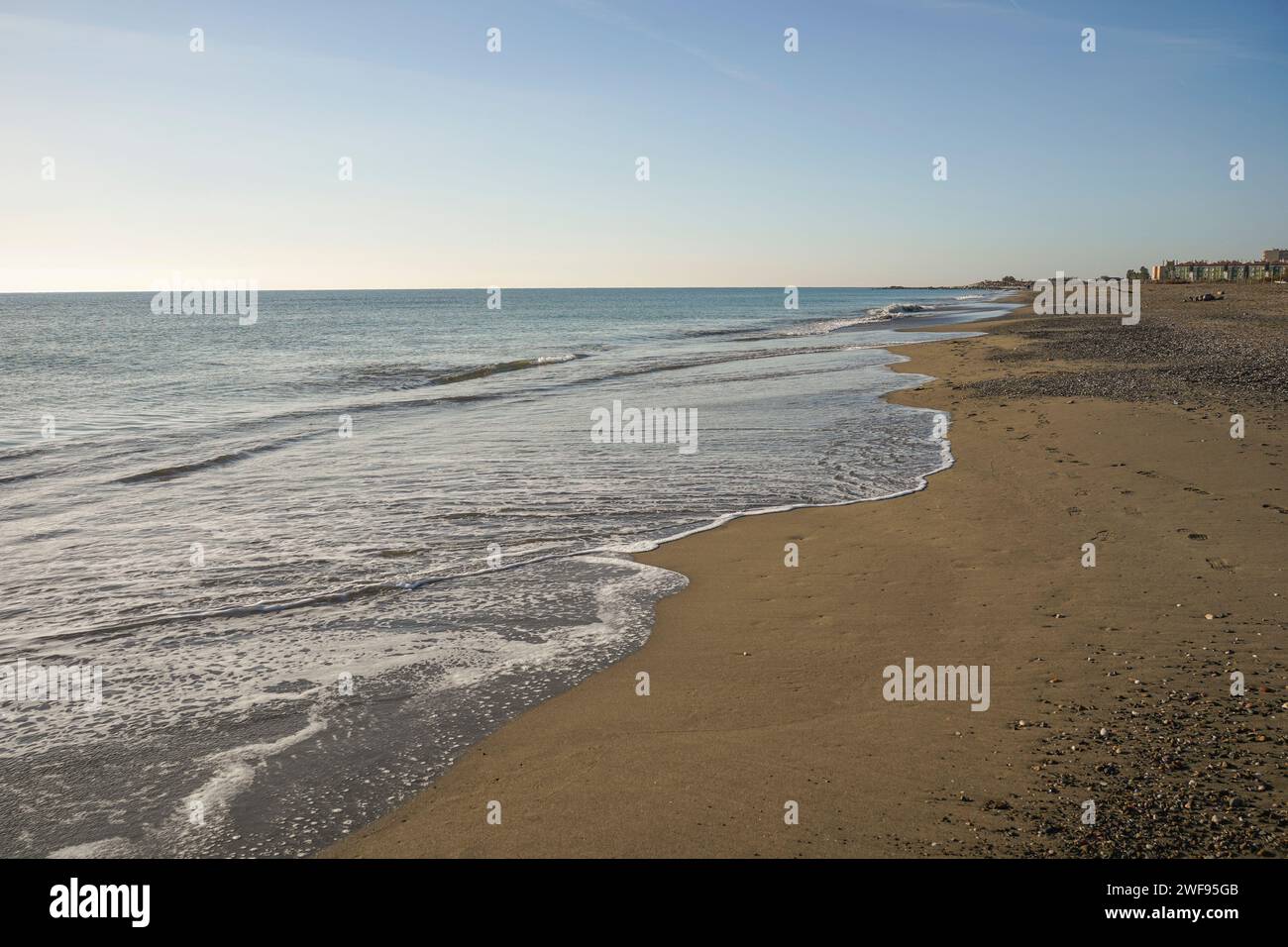 Sea tide sweeping in at beach. Spain Stock Photo - Alamy