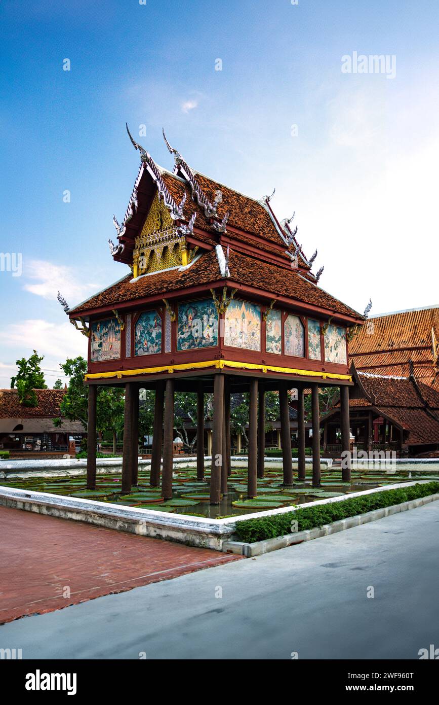 A striking Thai temple on stilts that stands tall over water pond Stock ...