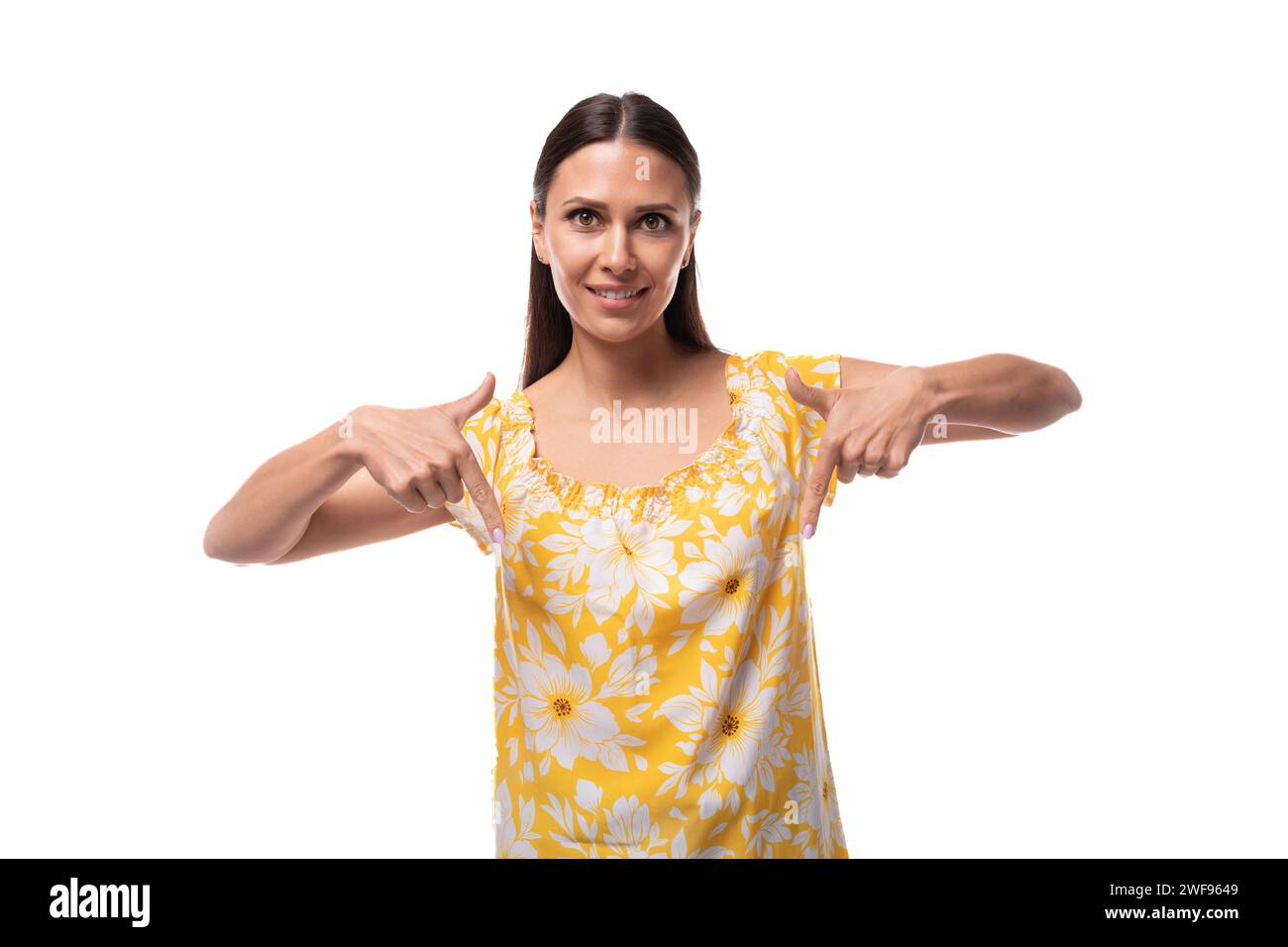 a young pretty woman with straight black hair in a yellow sundress with ...