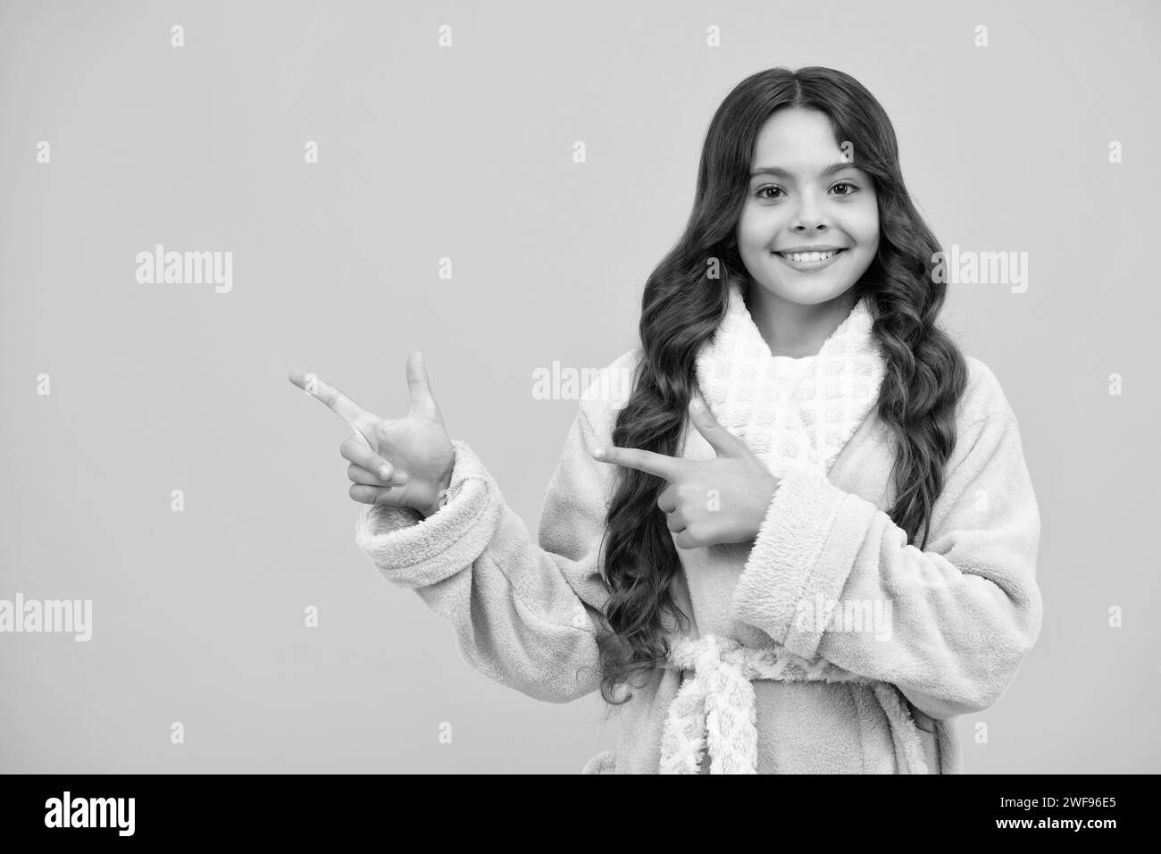 Look at advert. Teenager child points aside shows blank copy space for ...