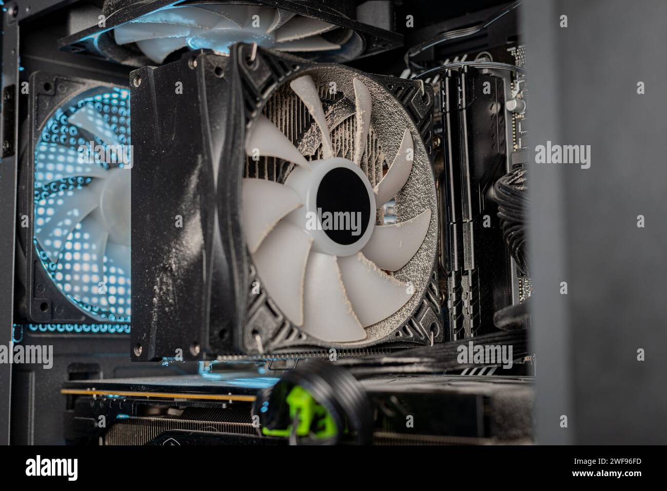 Dust inside of a broken computer. complication of the PC. fan and other ...