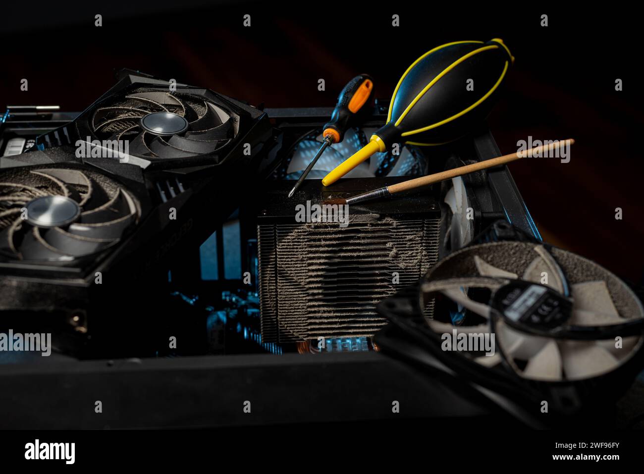 Dust inside of a broken computer. complication of the PC. fan and other ...