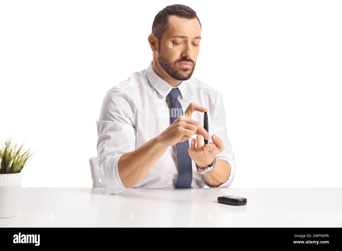 Businessman pricking finger and checking blood sugar level isolated on ...