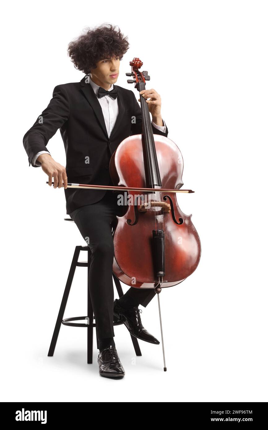 Young male artist sitting on a chair and playing a cello isolated on ...