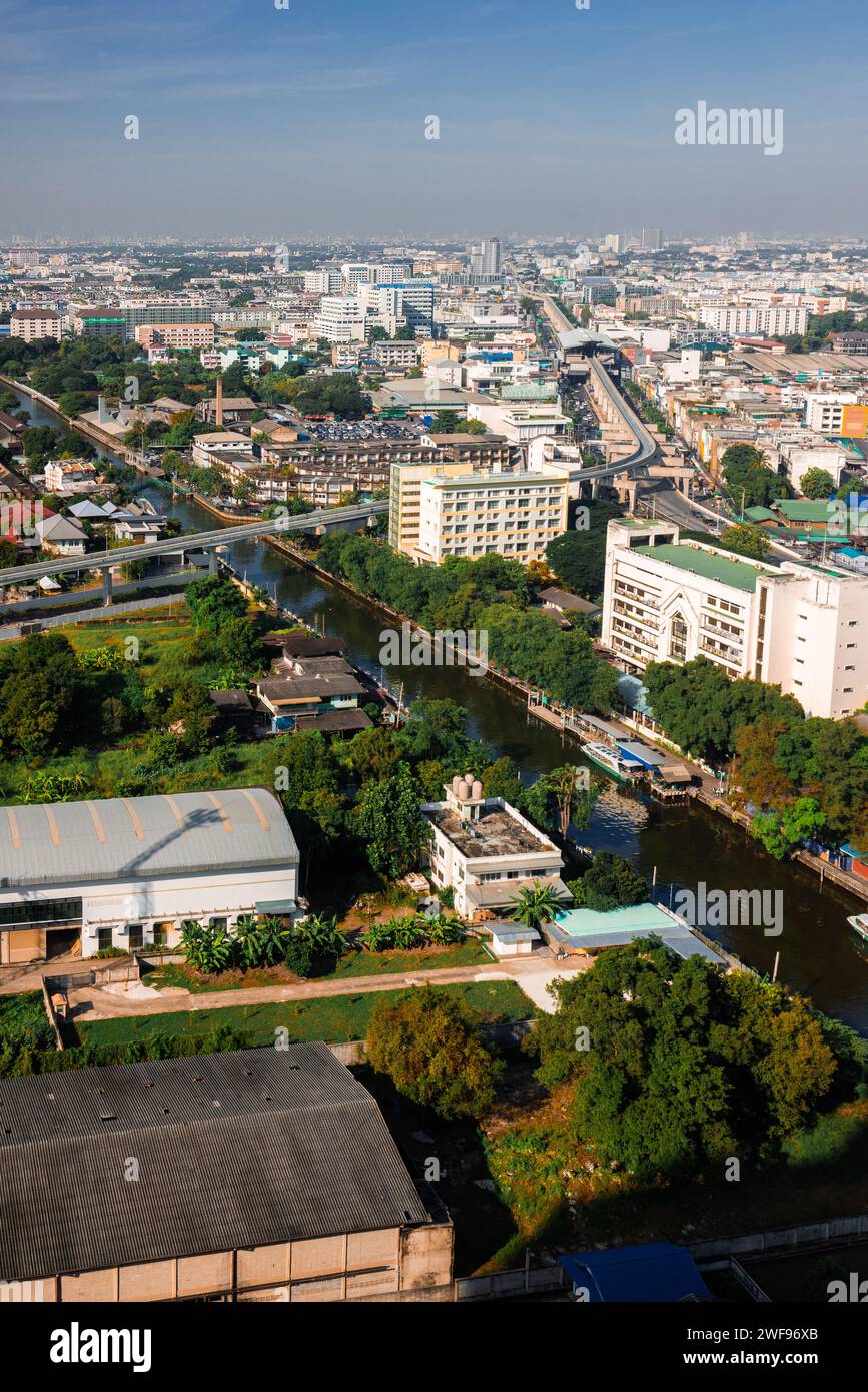 This photo captures an expansive aerial perspective of Bangkok city ...
