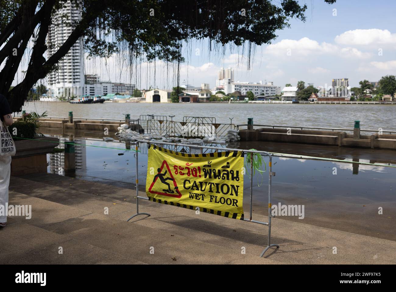 A caution sign, prominently displaying a warning about a water hazard ...