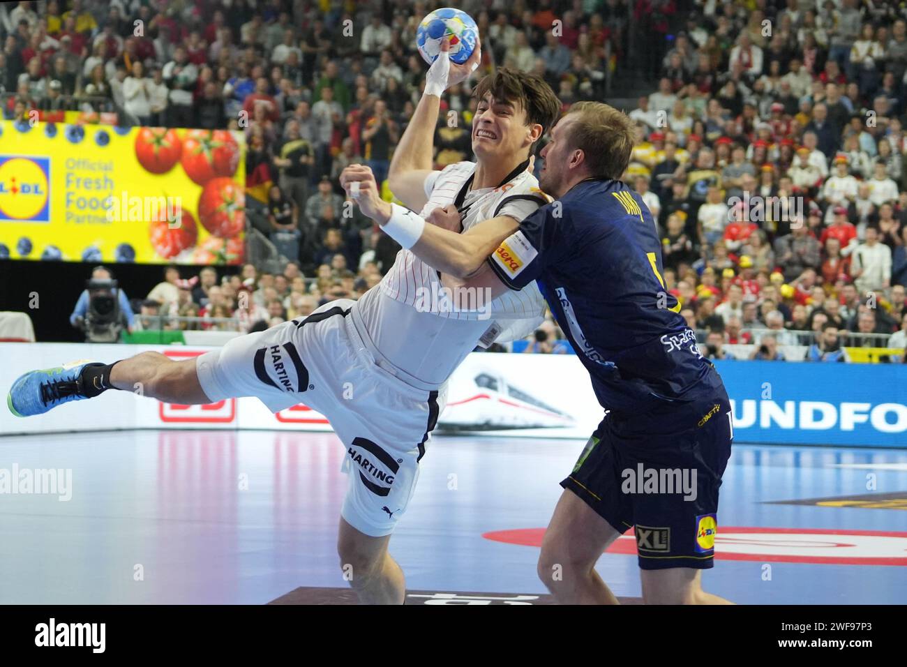 Julian Koster of Germany and Max Darj of Sweden during the Men's EHF ...