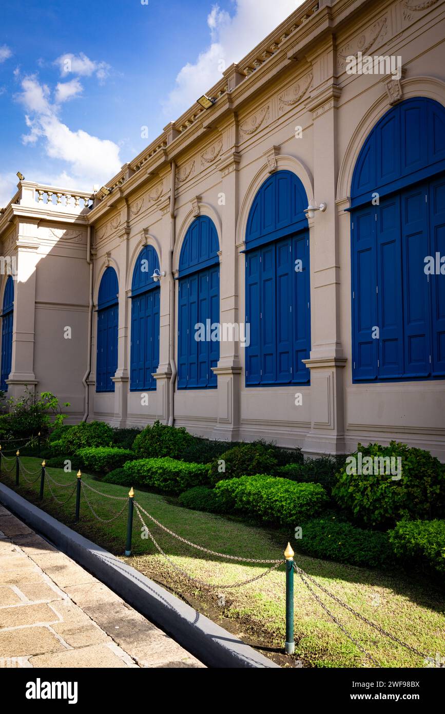 Vibrant blue windows add a contemporary flair to the exterior of a tall ...