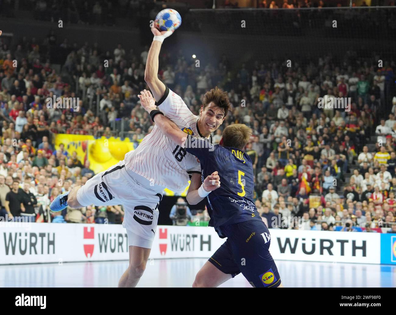 Julian Koster of Germany and Max Darj of Sweden during the Men's EHF ...
