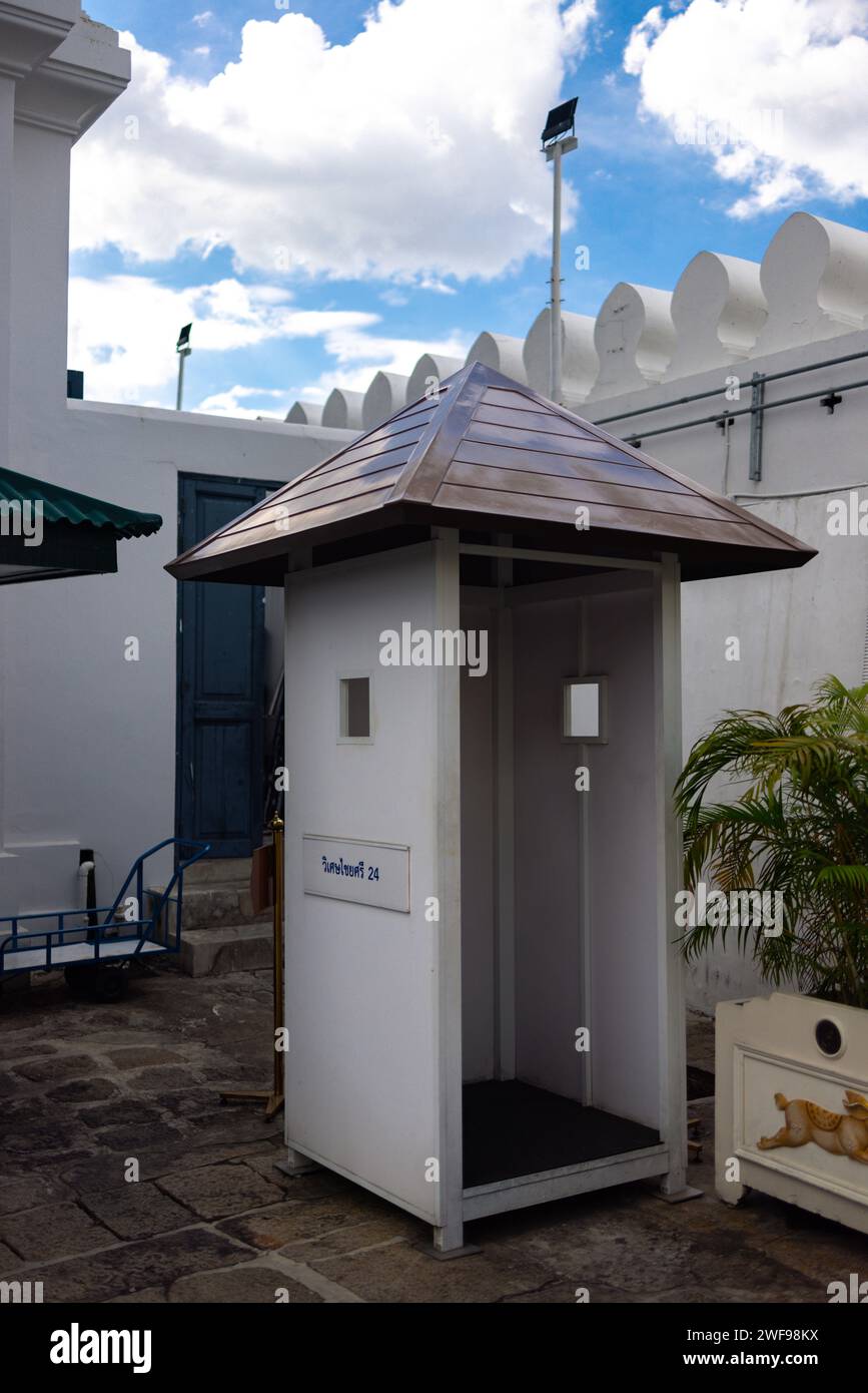 Small White Building With Brown Roof - A Charming Structure in a ...