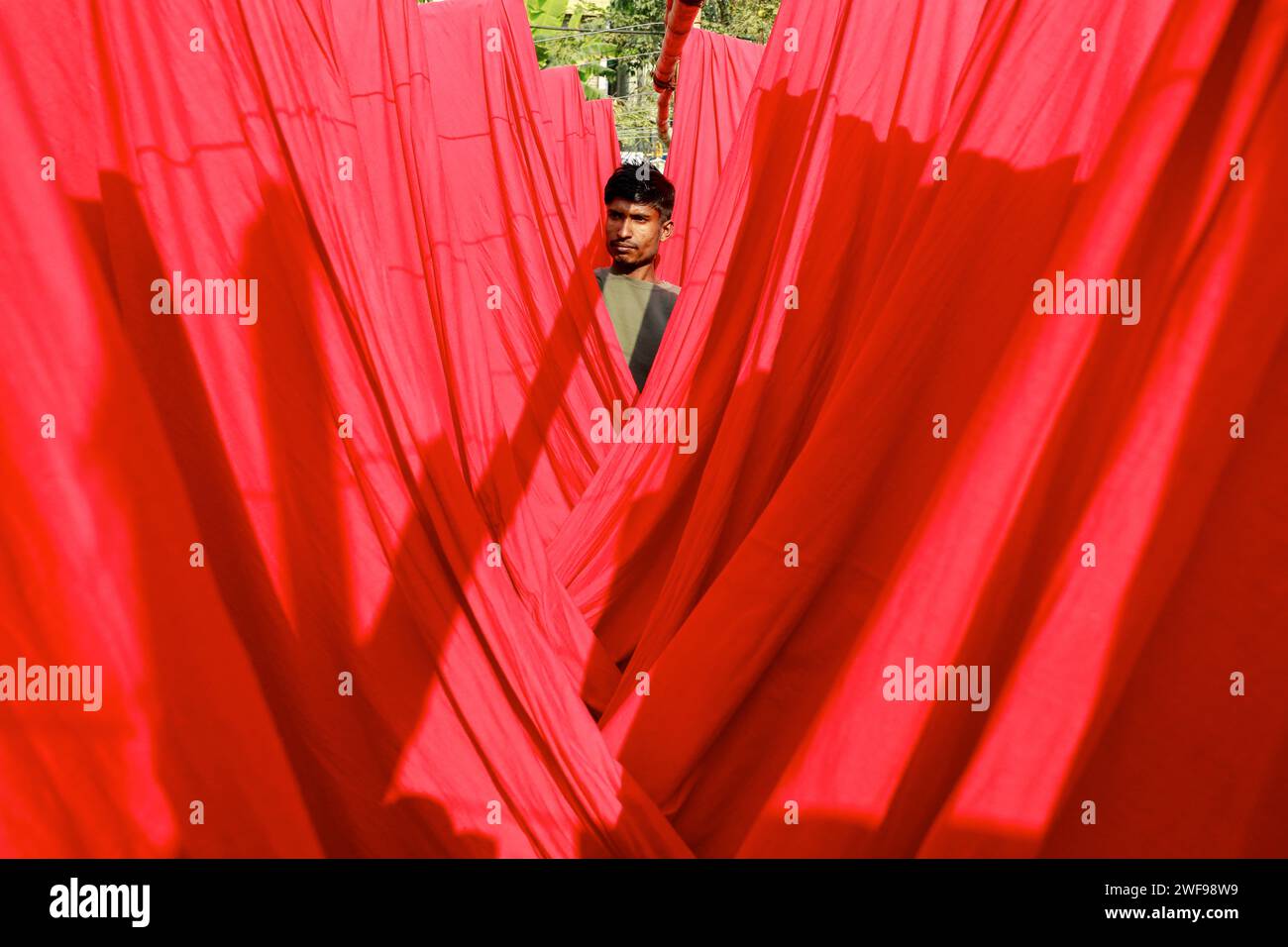 Dhaka, Bangladesh. 29th Jan, 2024. Bangladeshi workers collect fabric ...