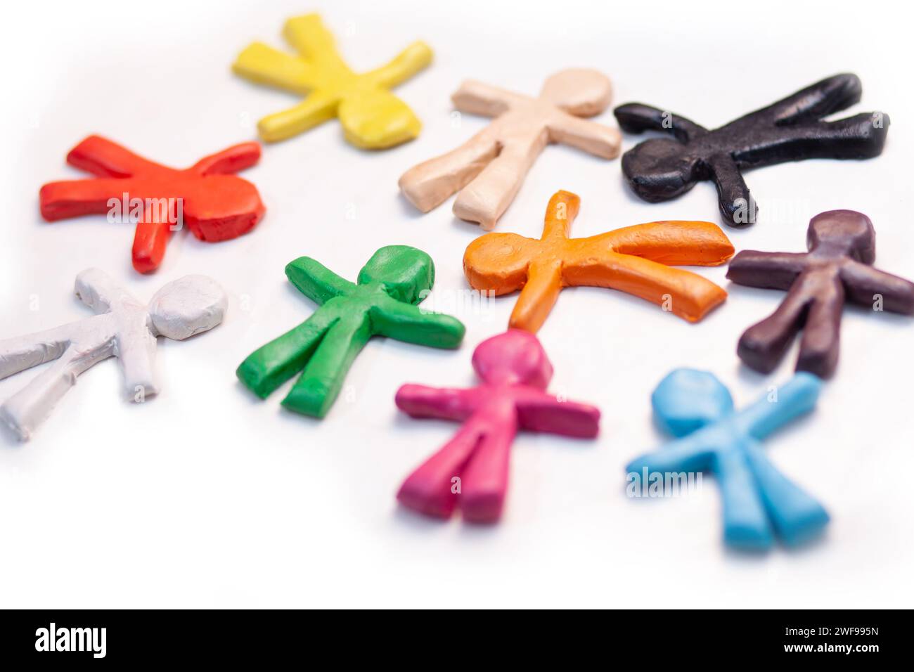 colorful clay people on white background Stock Photo - Alamy