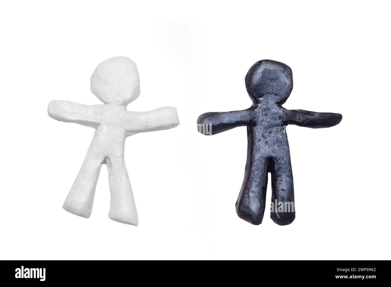 black and white clay people on white background Stock Photo - Alamy