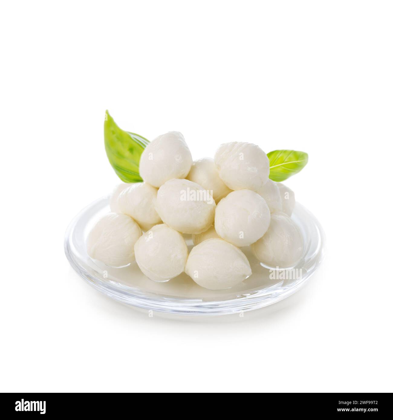 mini mozzarella cheese balls with basil isolated on white background ...