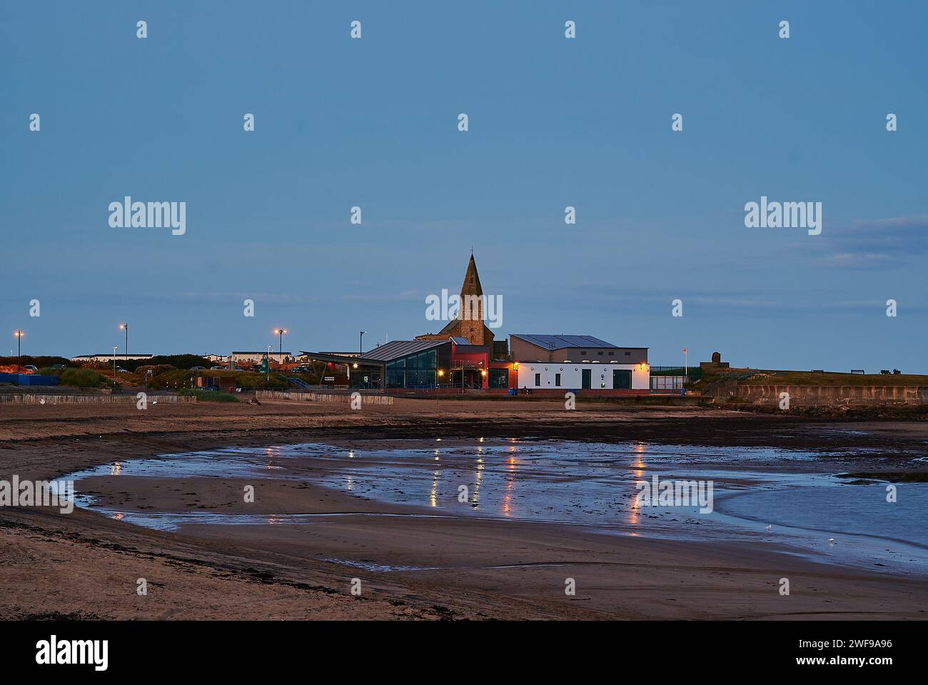 Newbiggin Bay & Beach with St Bartholomew's Church and the Maritime Centre in the distance Stock ...
