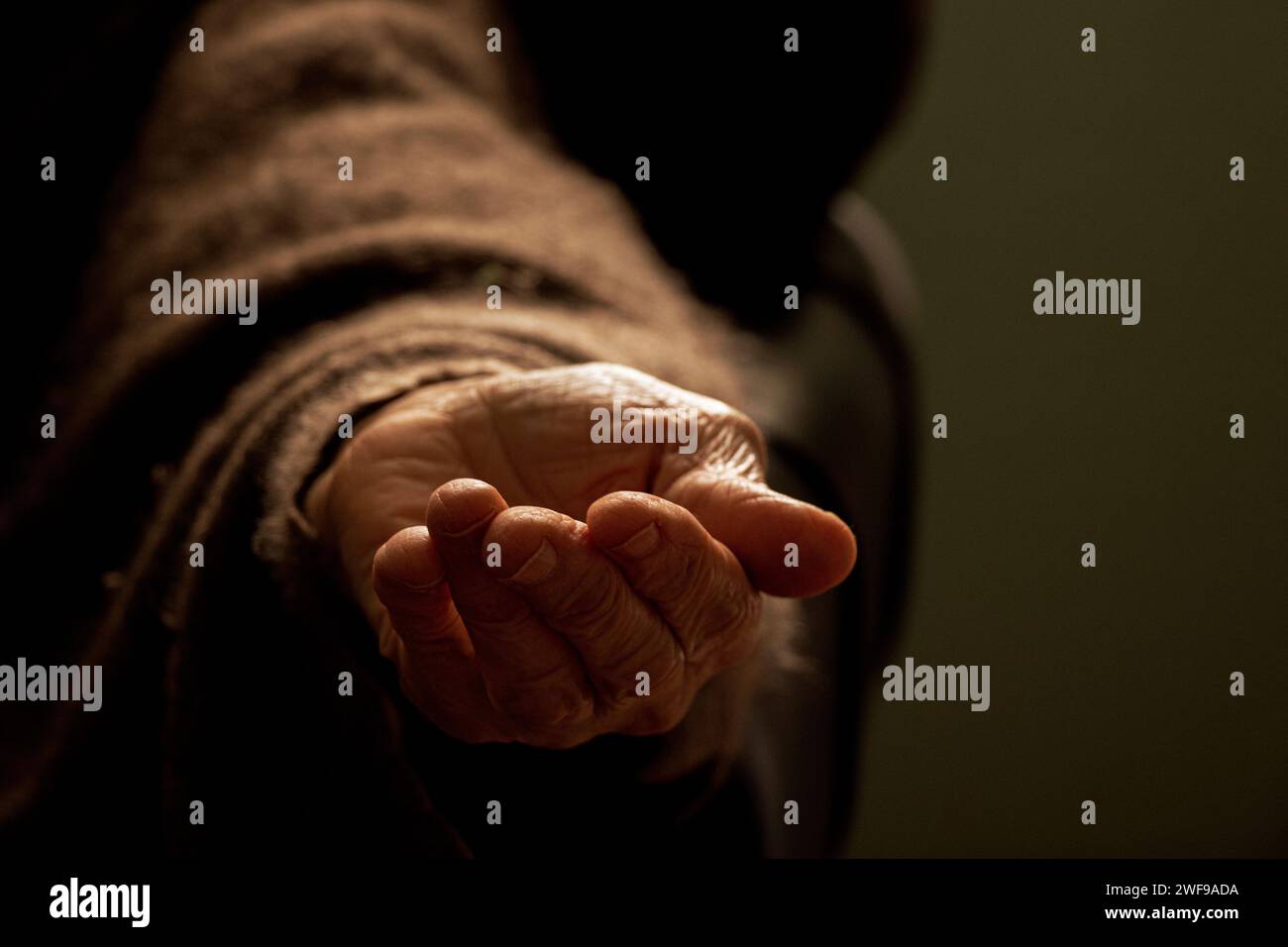 Outstretched begging hand hi-res stock photography and images - Alamy