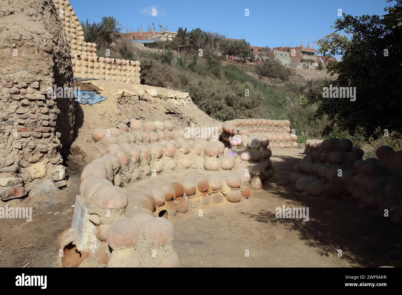 pottery, rubish, buildings in a village Stock Photo - Alamy