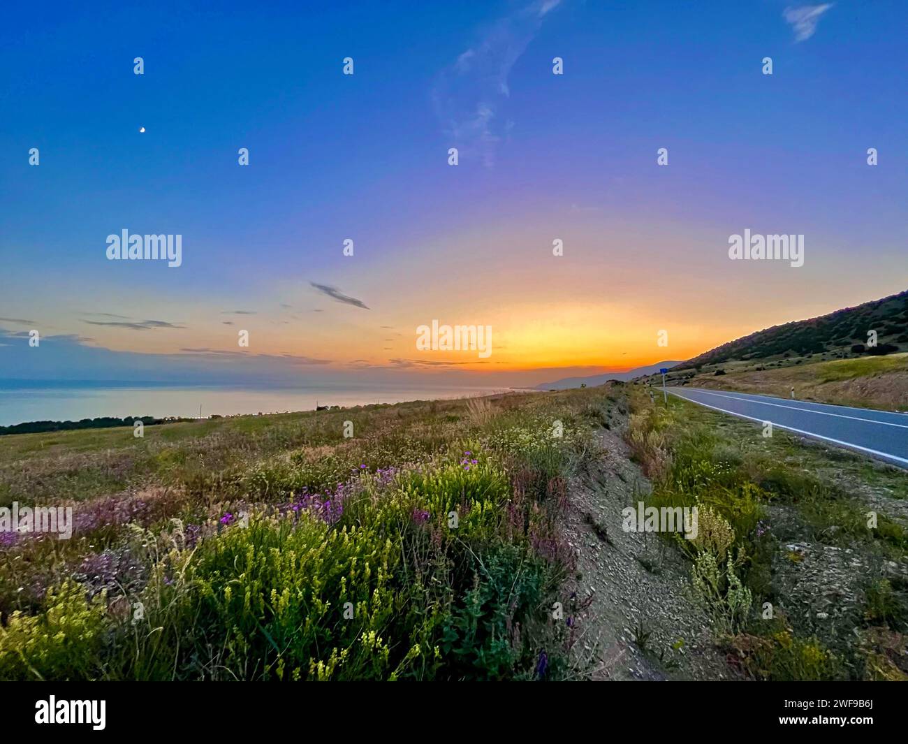 A Sunset view from hilltop overlooking road Stock Photo - Alamy