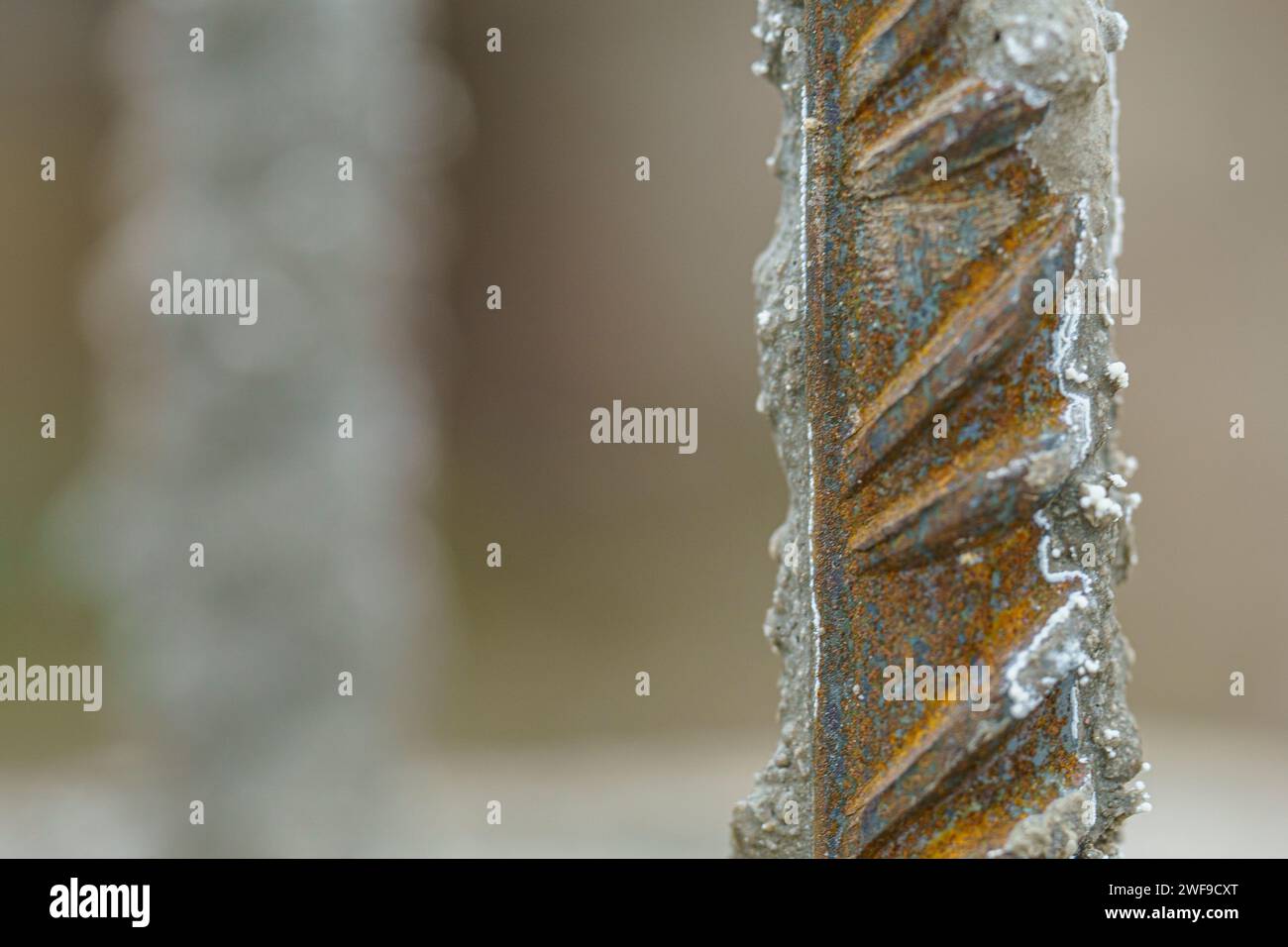Rusted metal pipe protruding from earthen backdrop Stock Photo - Alamy