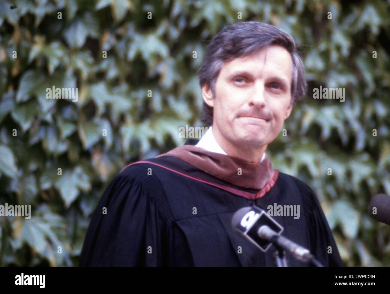 Alan Alda in commencement robe, giving speech, 1970s. Photo: Oscar ...