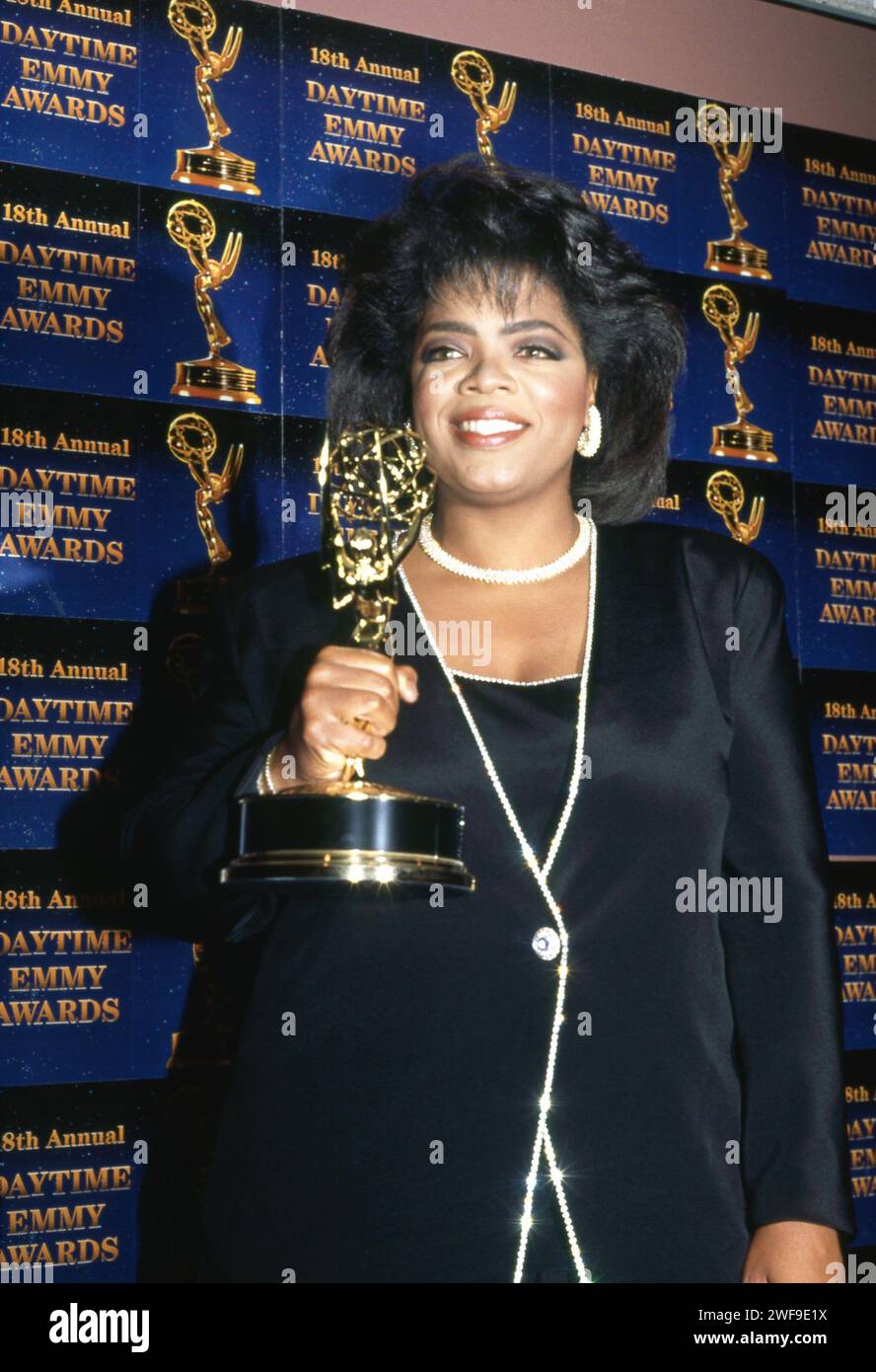Oprah Winfrey holding her Emmy at the 1991 Daytime Emmy Award Ceremony ...