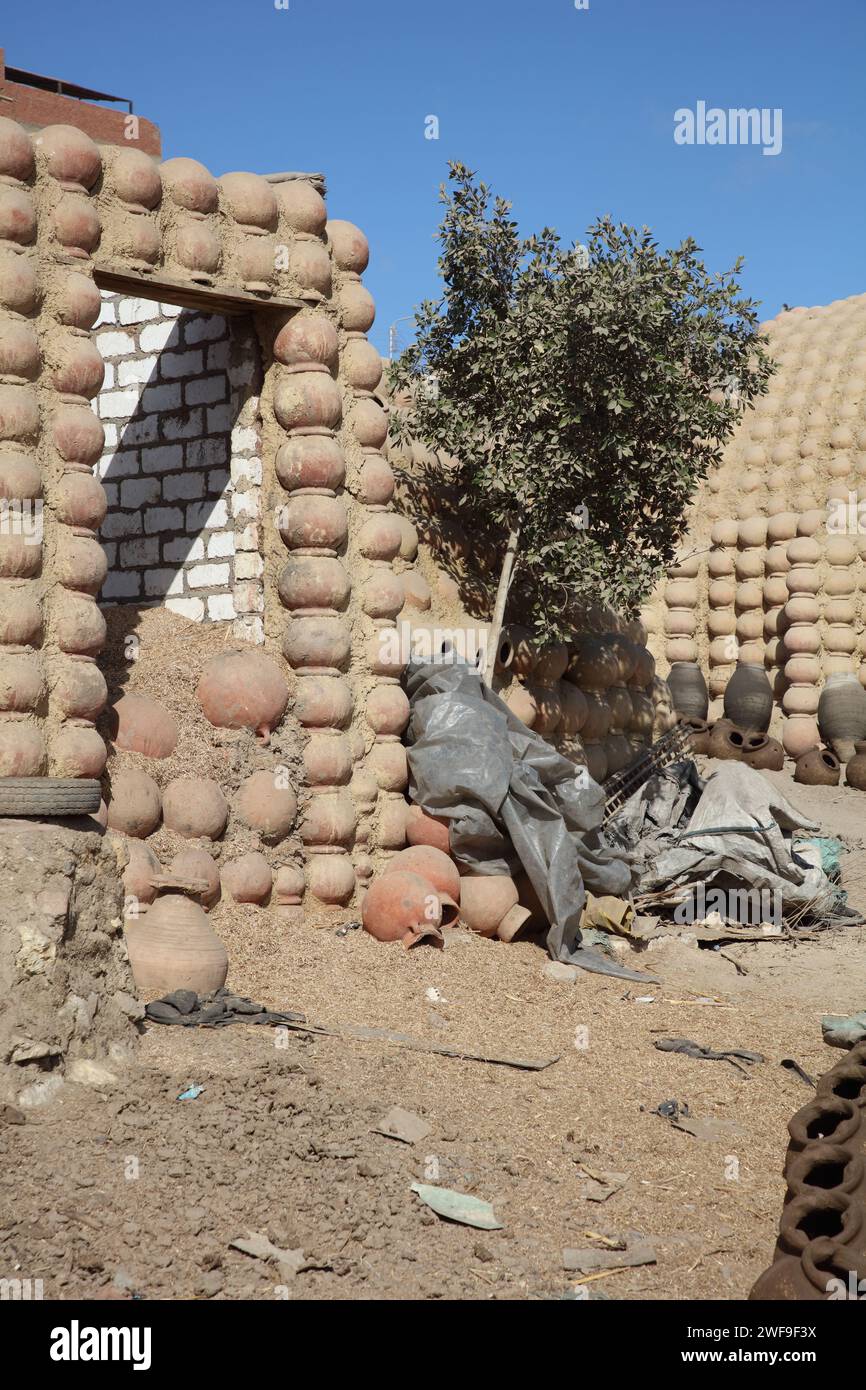 pottery, buildings, rubish in a village Stock Photo - Alamy