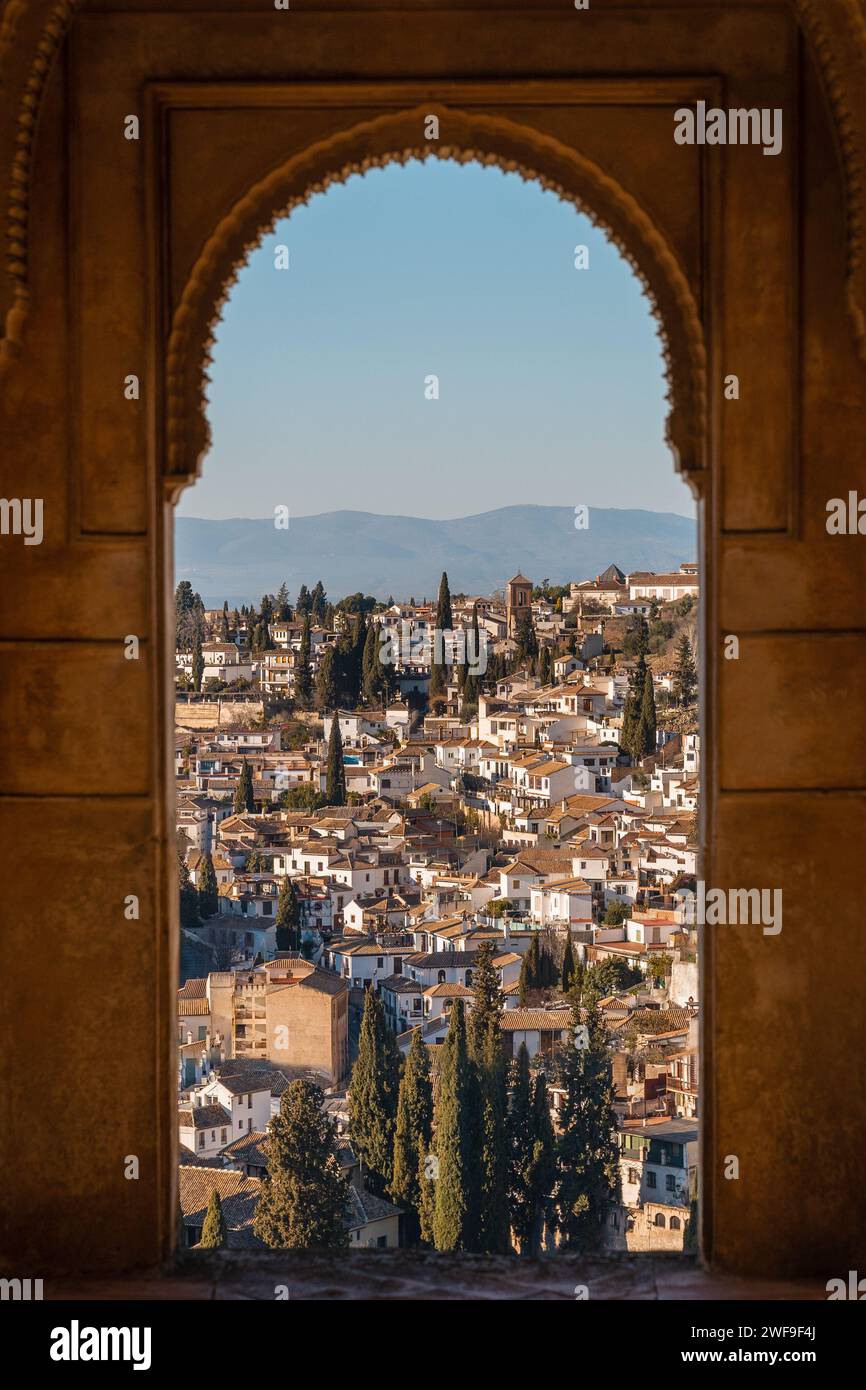 A View of the old town of Granada inside an arch of the Alhambra, Spain ...