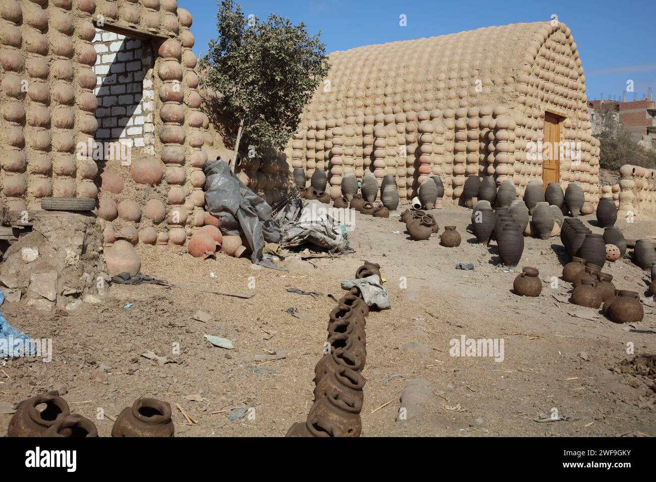 pottery, buildings, rubish in a village Stock Photo - Alamy