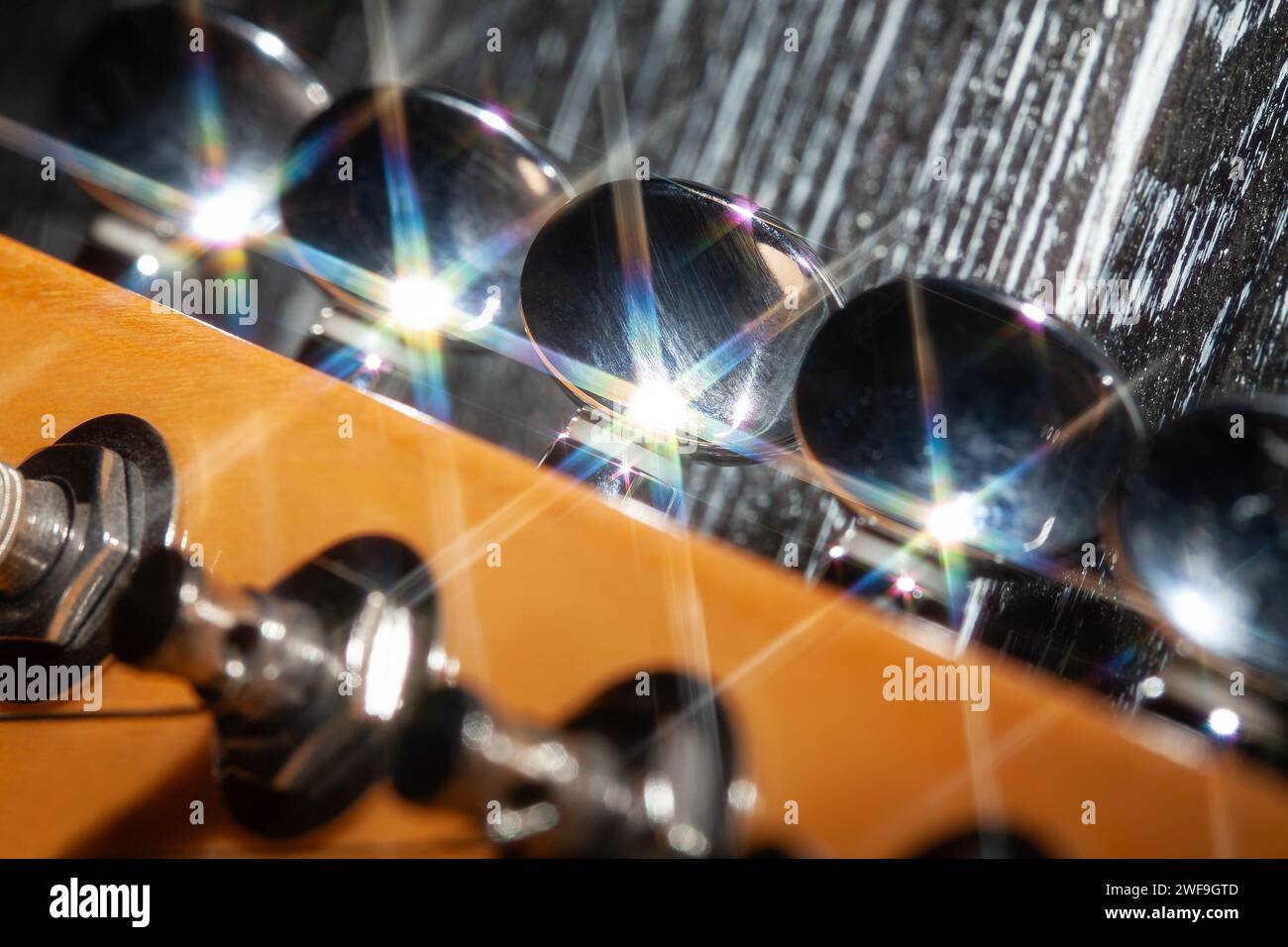 electric guitar tuning machines macro closeup on wood background Stock ...