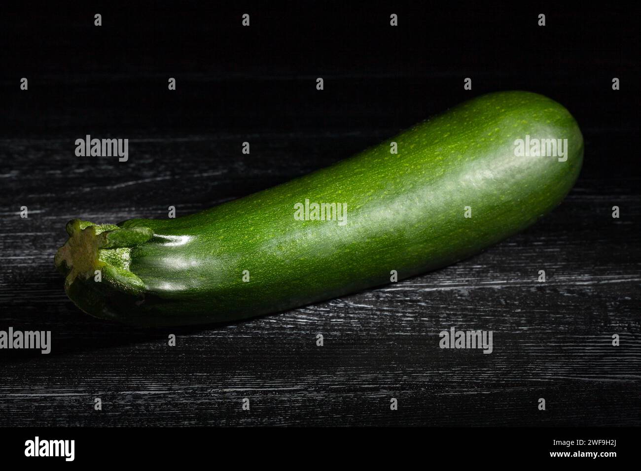 Fresh zucchini on dark hi-res stock photography and images - Alamy