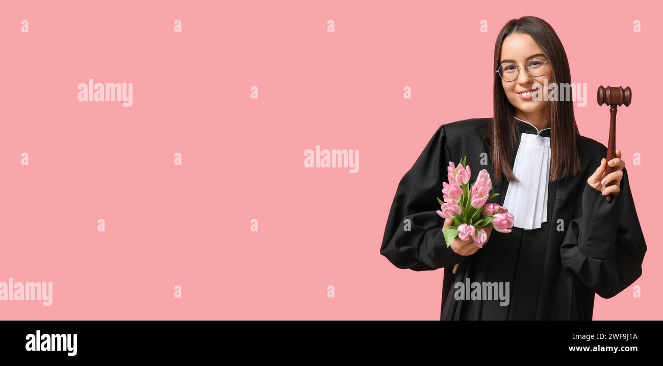 Female judge holding flowers on pink background with space for text ...