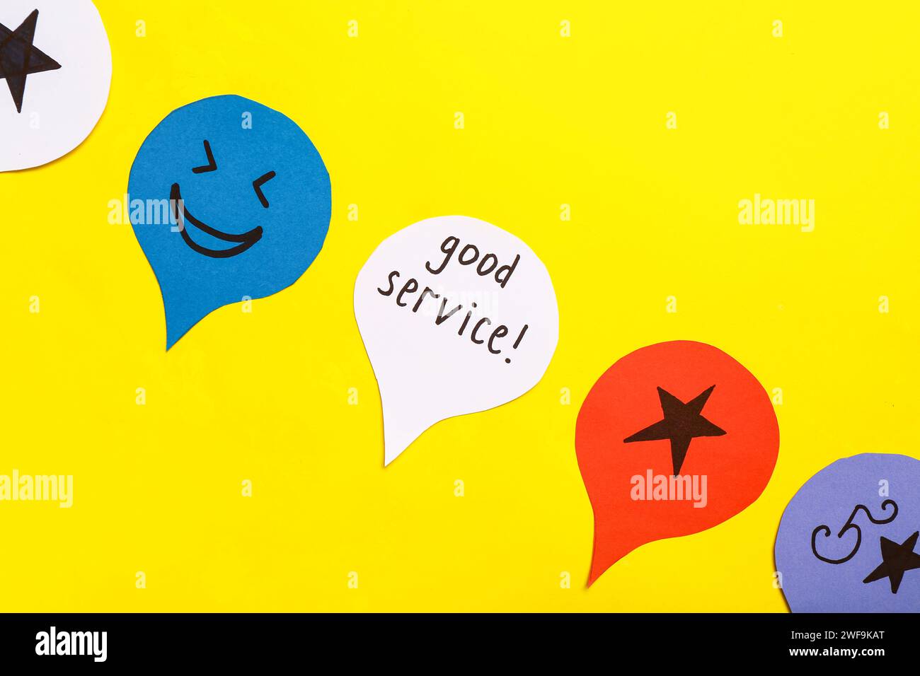 Speech bubbles with reviews on yellow background, closeup. Customer ...