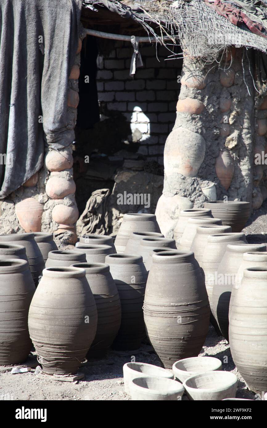 pottery, rubish, buildings in a village Stock Photo - Alamy