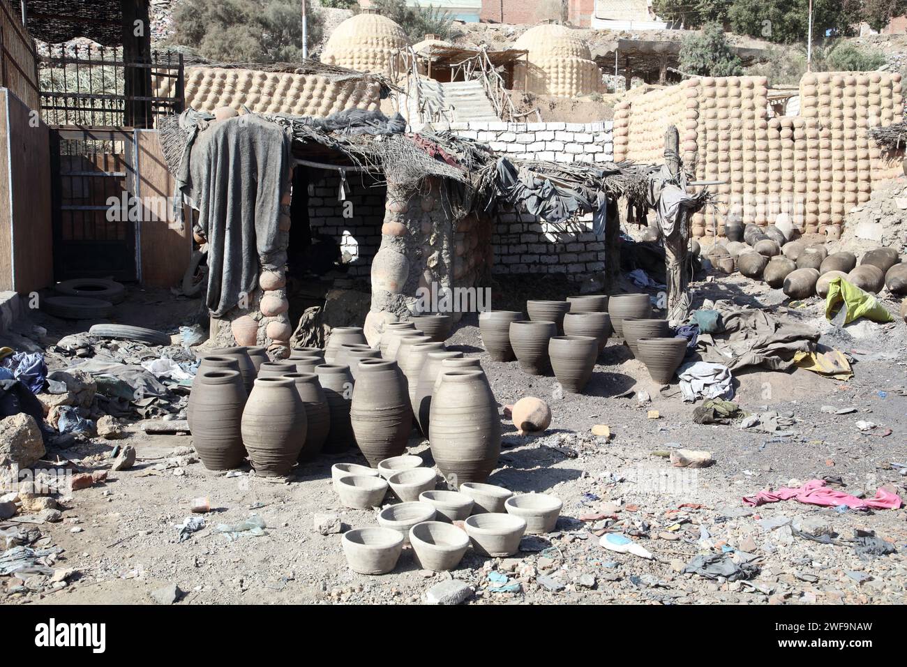 pottery, rubish, buildings in a village Stock Photo - Alamy