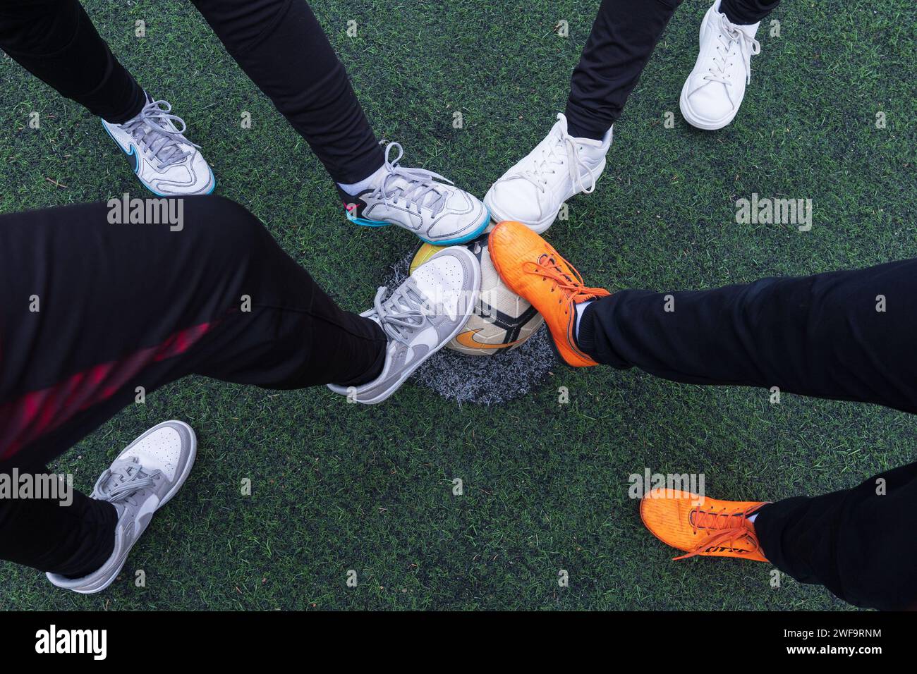Footwear display on top of soccer ball, sport gear sneakers nike brand ...