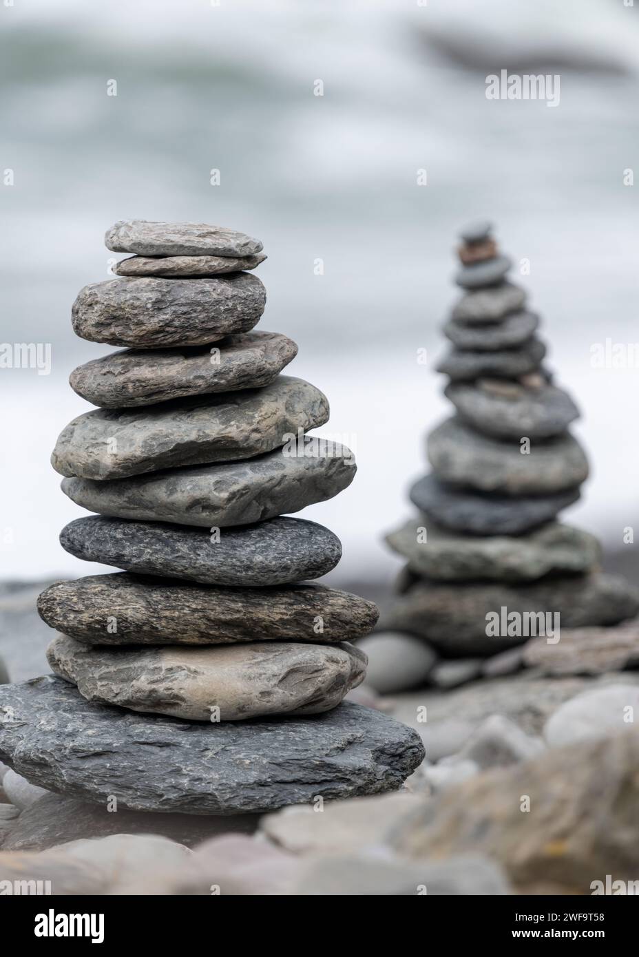 Close up of two towers of pebbles stacked up on a pebble beach Stock ...