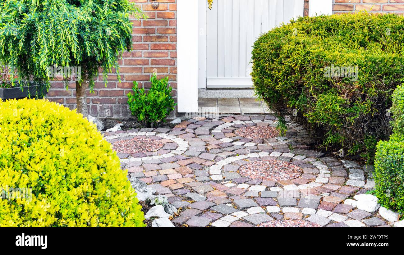 Original garden path with circular paving close-up. Pathway from brick ...