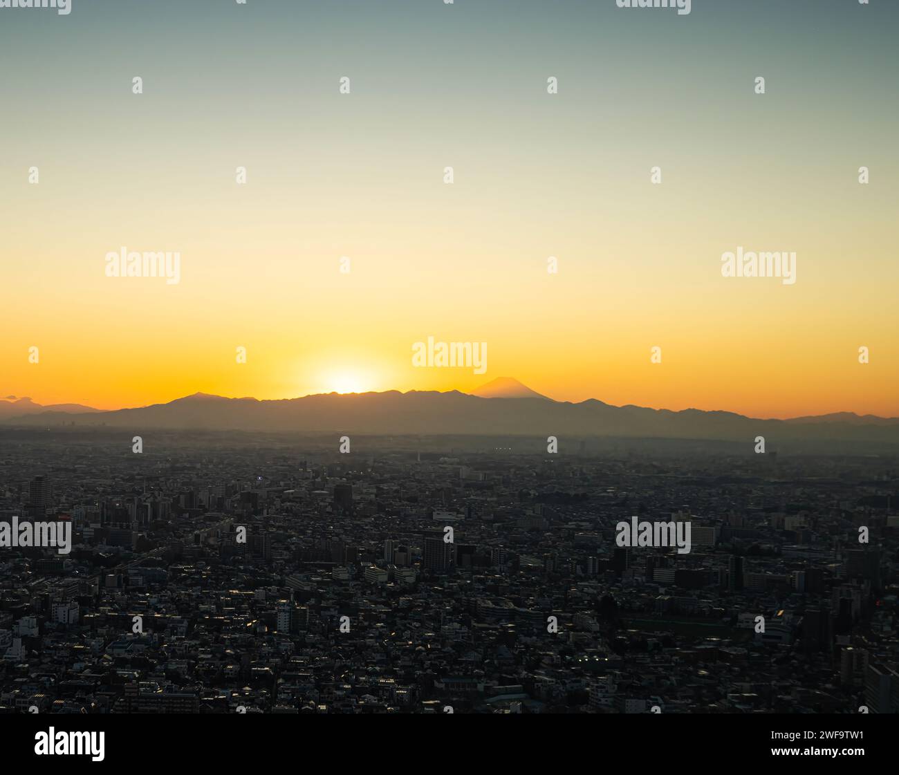 Tokyo, Japan. January 9, 2024. Mount Fuji seen at sunset from the city ...