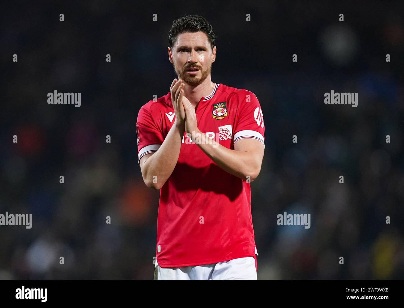 Wrexham's George Evans applauds fans after the Emirates FA Cup fourth ...