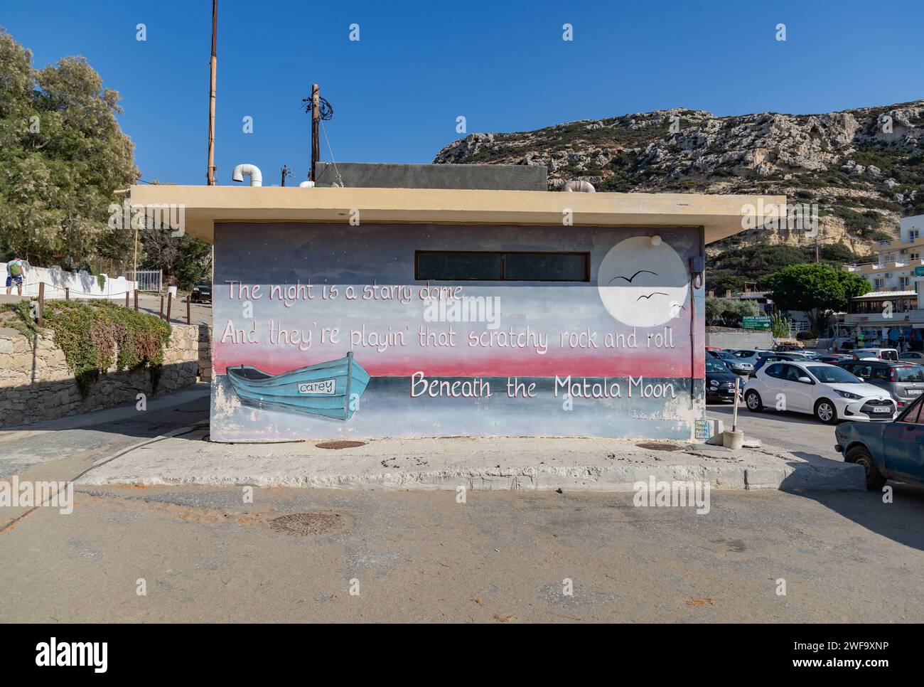 A picture of a mural with a nice poem on a small structure in Matala ...