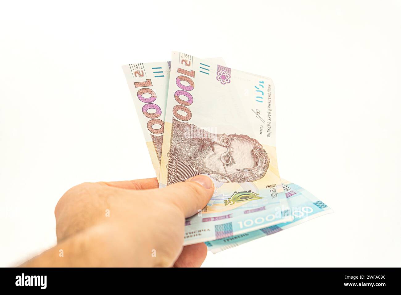 1000 hryvnia in hand isolated on a white background. Banknote with the ...