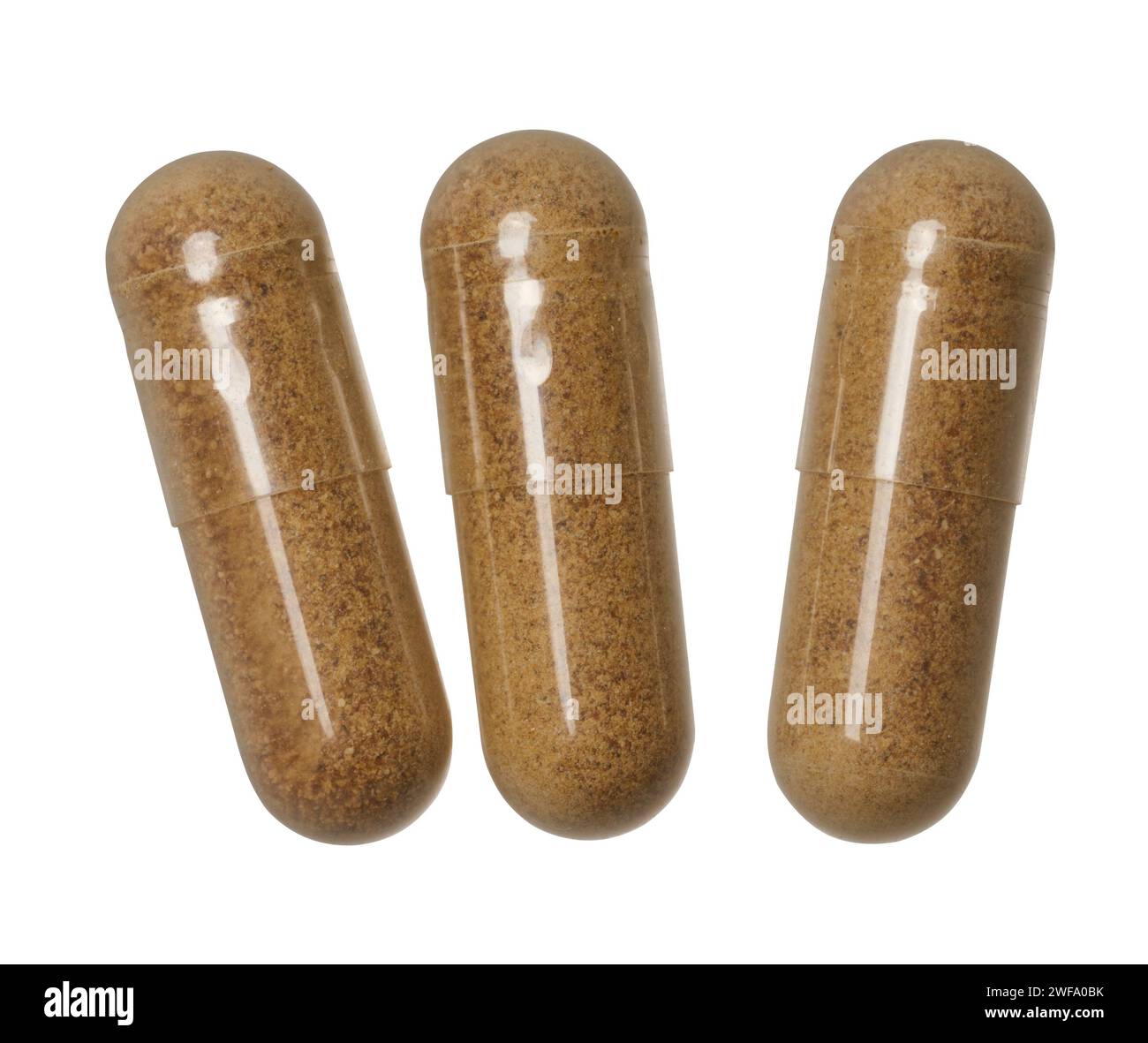 Transparent capsule with brown powder on isolated background, medical ...