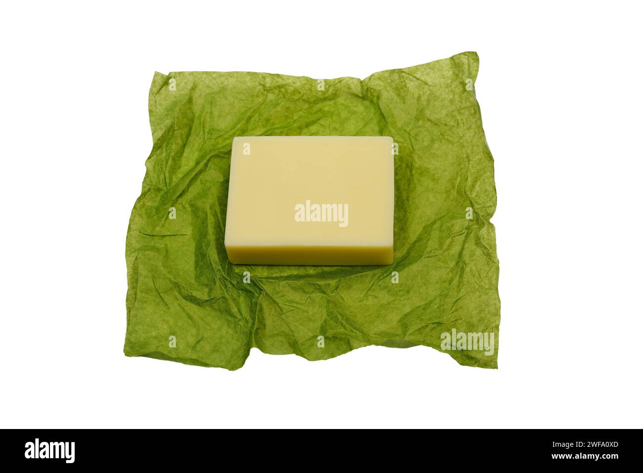 bar of soap on green paper wrapper on white background Stock Photo - Alamy