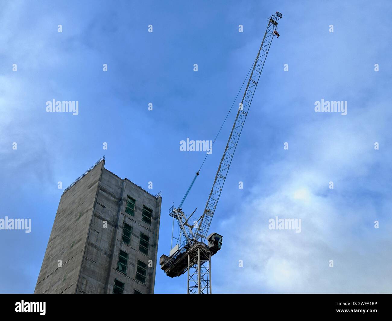 Tower cranes at new high rise apartment development during construction ...