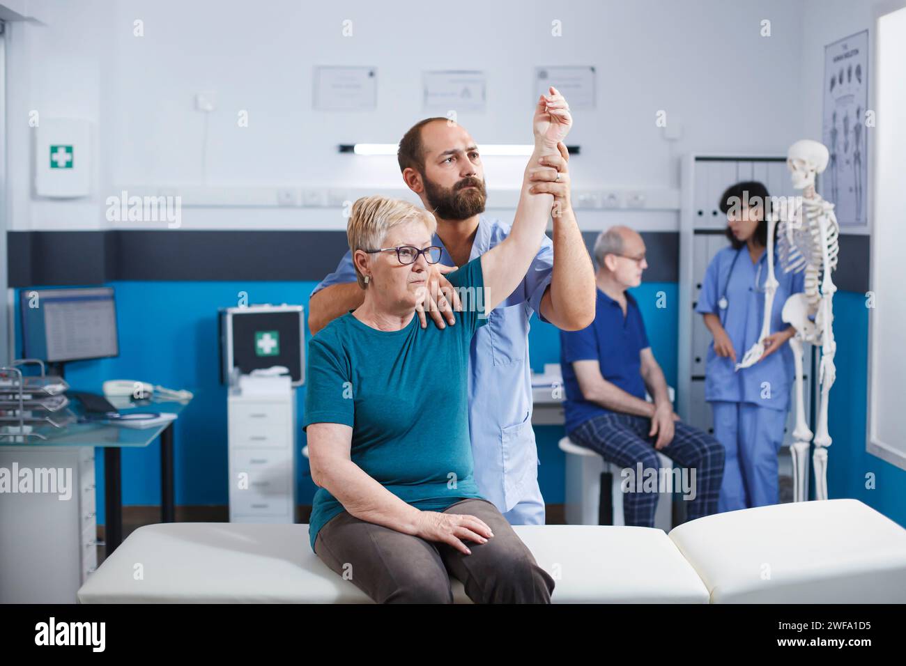 Elderly patient receives physiotherapy treatment and rehabilitation ...