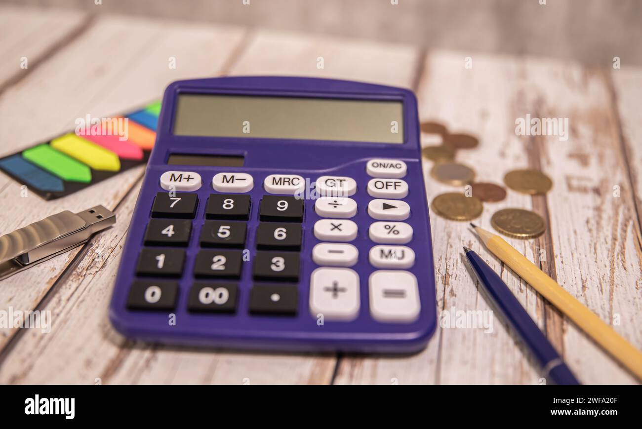 Blue digital calculator on a white background. Top view with place to ...