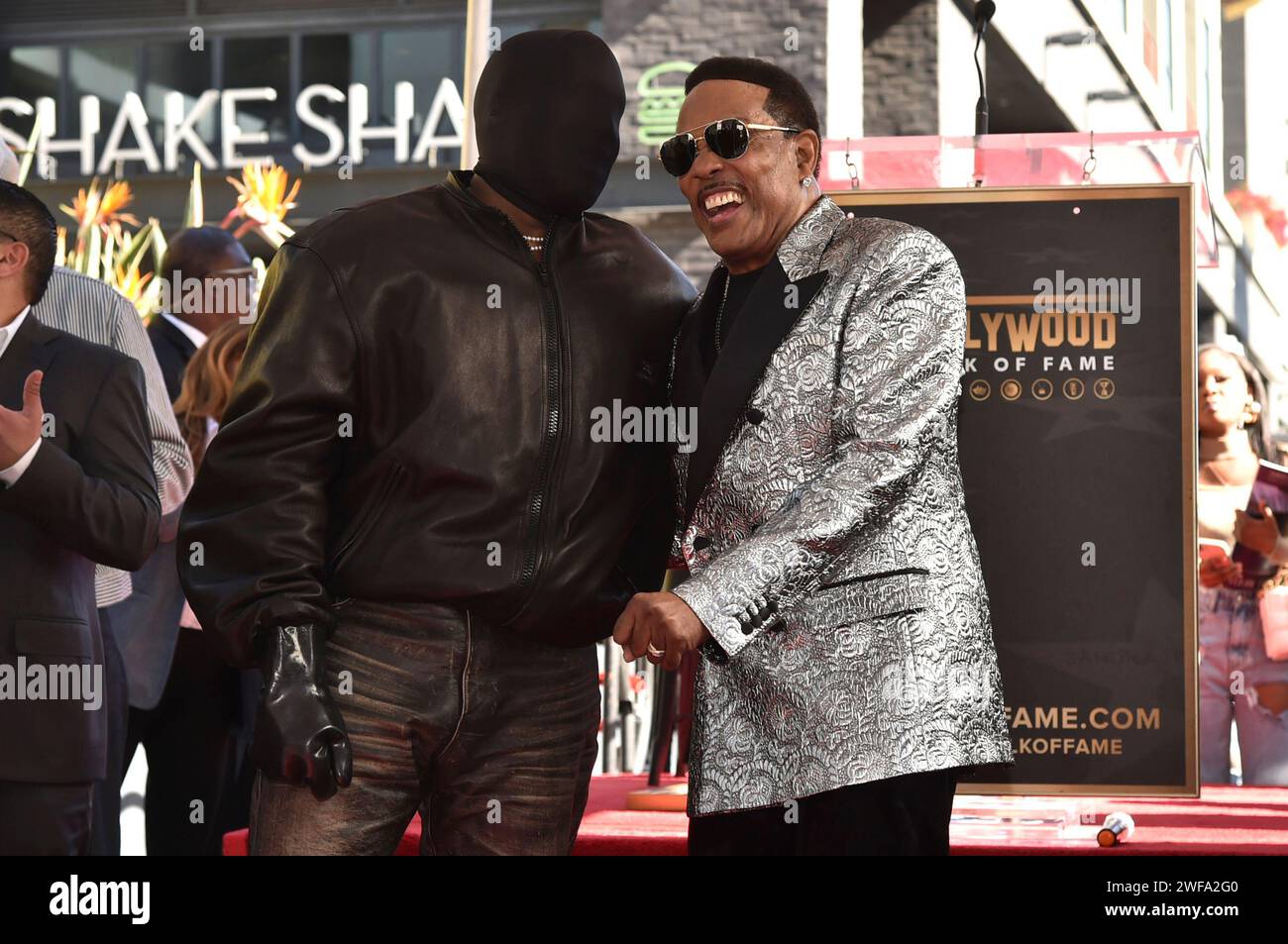 Kanye West, left, and Charlie Wilson attend a ceremony honoring Wilson ...