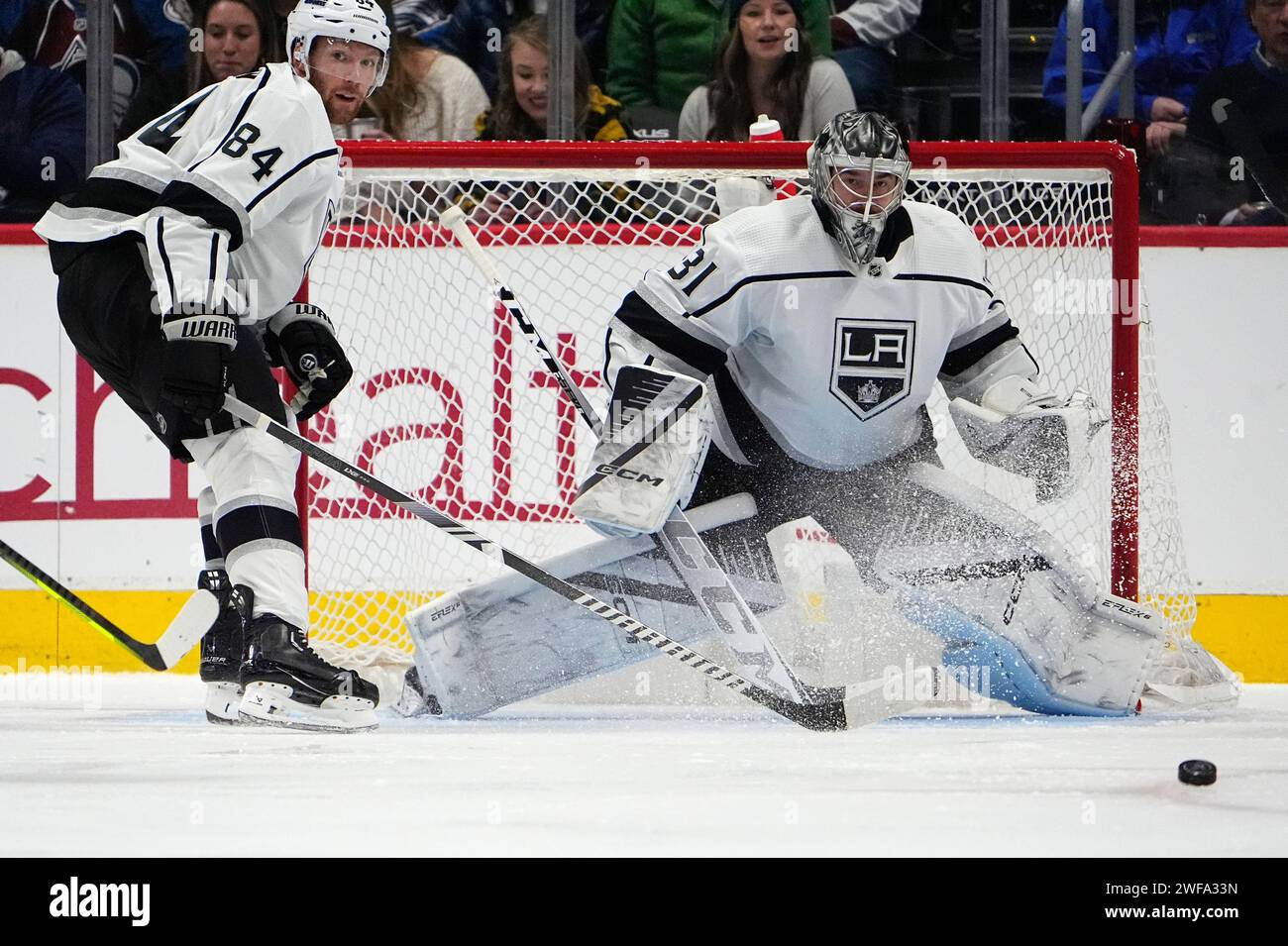 Los Angeles Kings defenseman Vladislav Gavrikov (84) and goaltender ...